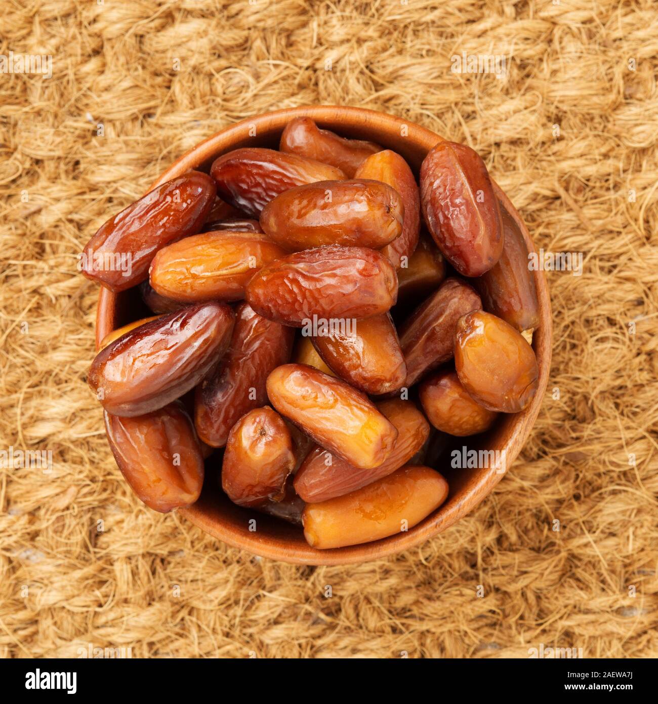 Dates, dried fruits in wooden bowl. Traditional food of the middle East ...