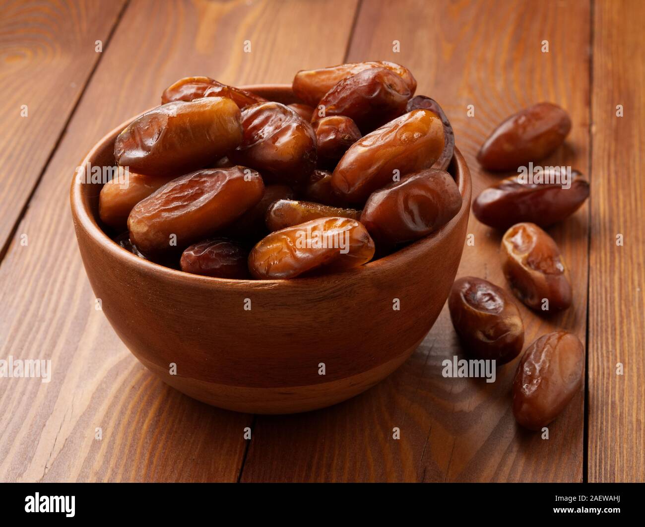 Dates, dried fruits in wooden bowl. Traditional food of the middle East ...