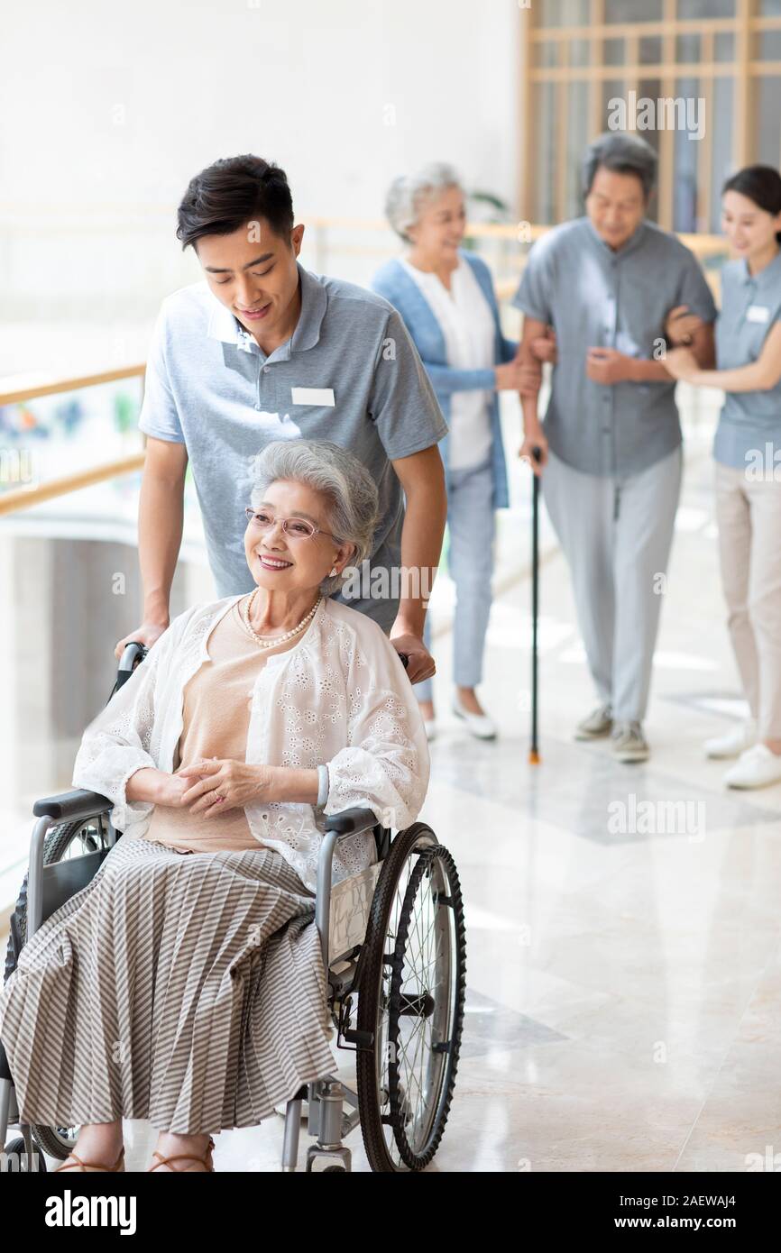 Nursing assistant taking care of senior people Stock Photo - Alamy