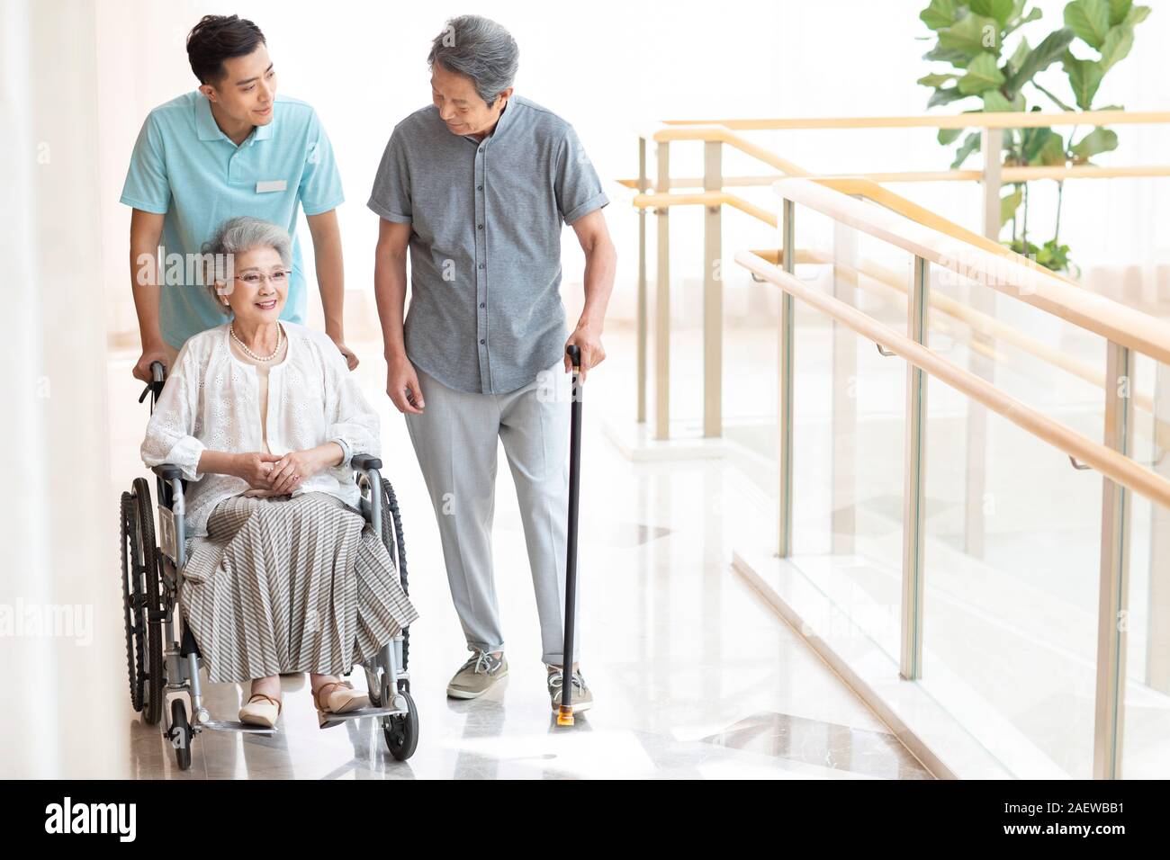 Nursing assistant taking care of senior woman Stock Photo - Alamy