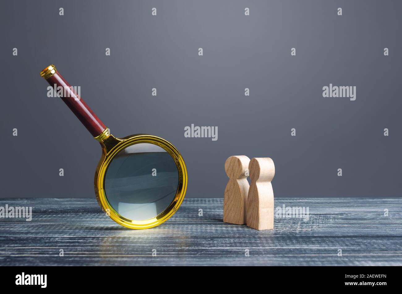 People look at a huge magnifying glass. Search and analysis, analytics ...
