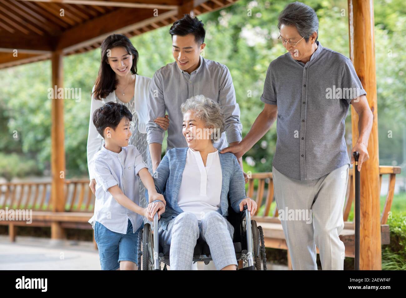 Happy family walking in corridor Stock Photo - Alamy