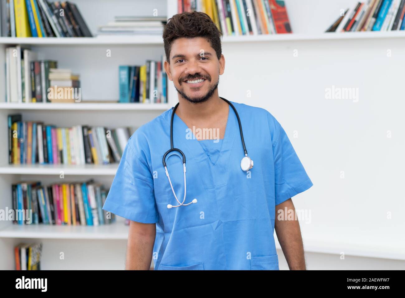 Laughing latin american doctor with beard at hospital Stock Photo - Alamy