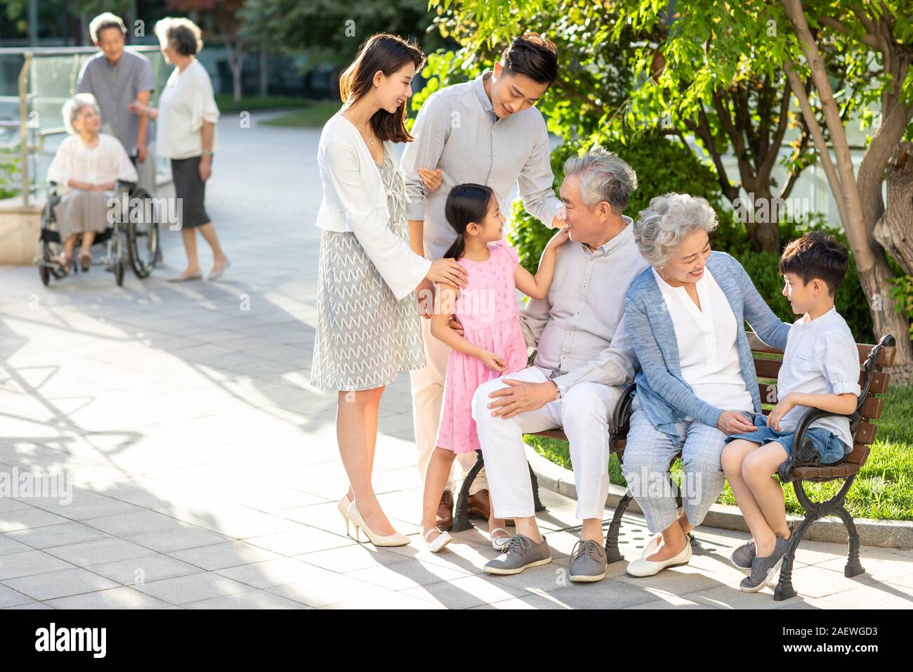Happy family relaxing in nursing home Stock Photo - Alamy