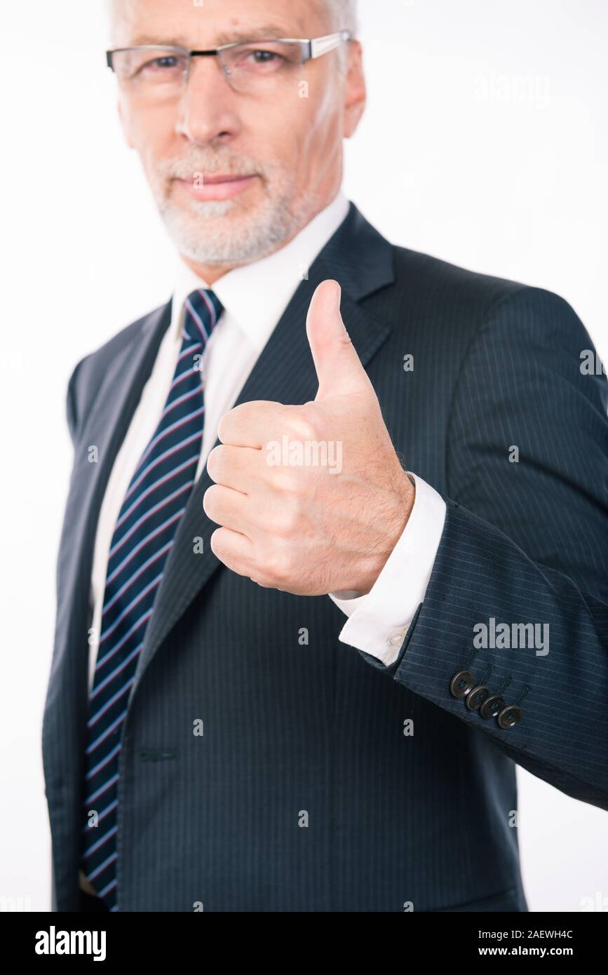 Confident intelligent businessman showing thumb up Stock Photo - Alamy Confident intelligent businessman showing thumb up Stock Photo - Alamy
