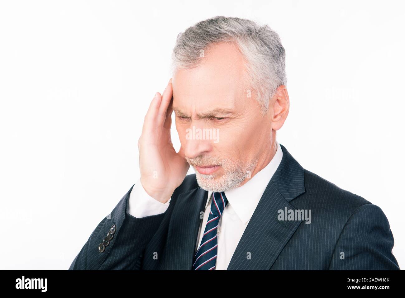 Old man suffering of headache in business suit Stock Photo - Alamy