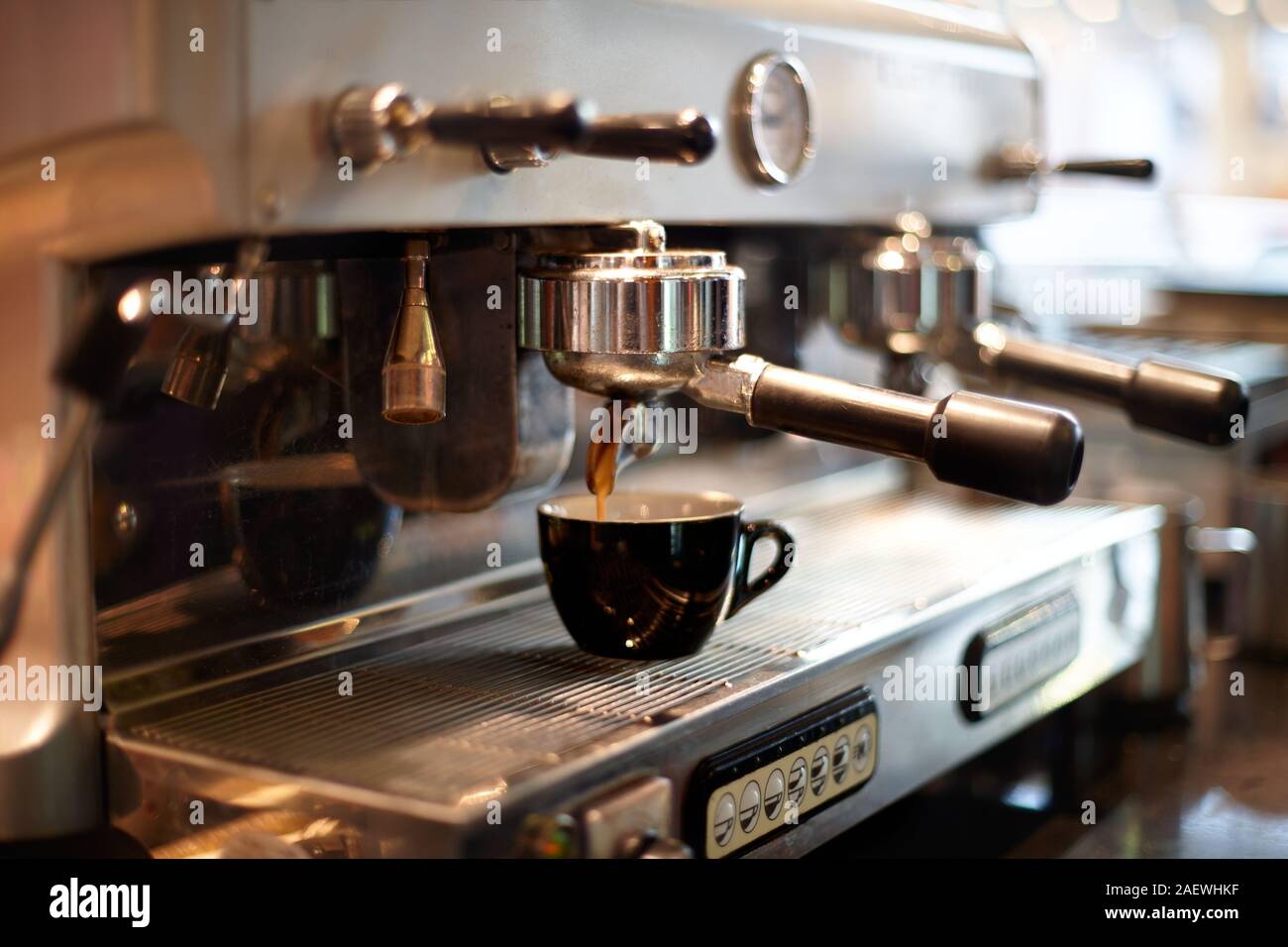 Making coffee in a professional coffee machine in a coffee shop Stock ...