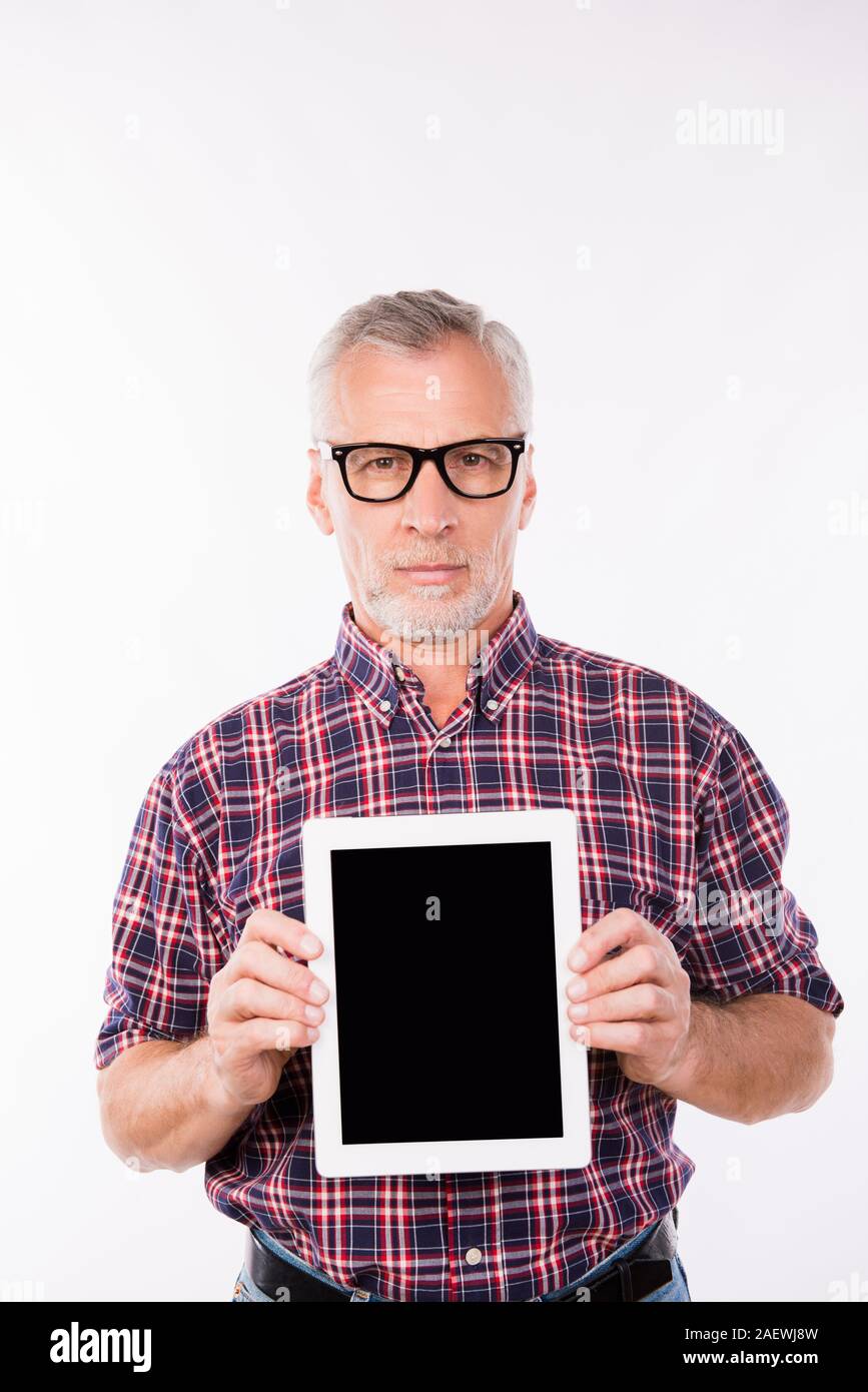 Confident gray aged man with glasses showing a screen of tablet Stock ...