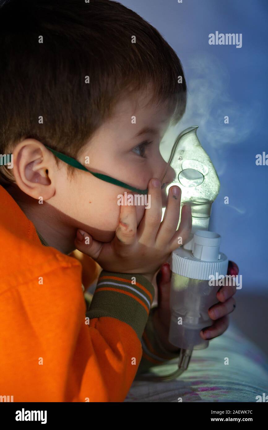 Little boy in a mask, treatments respiratory tract with a nebulizer at ...