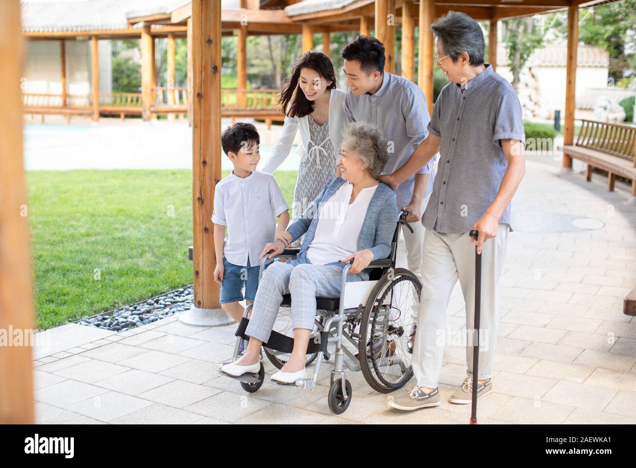 Happy family walking in corridor Stock Photo - Alamy