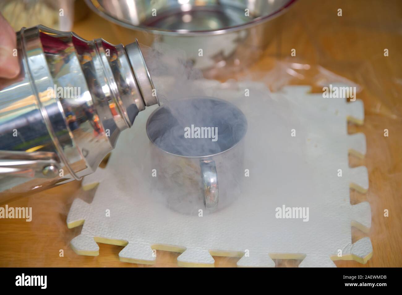 Chemical experiment, show with liquid nitrogen . researcher in uniform ...