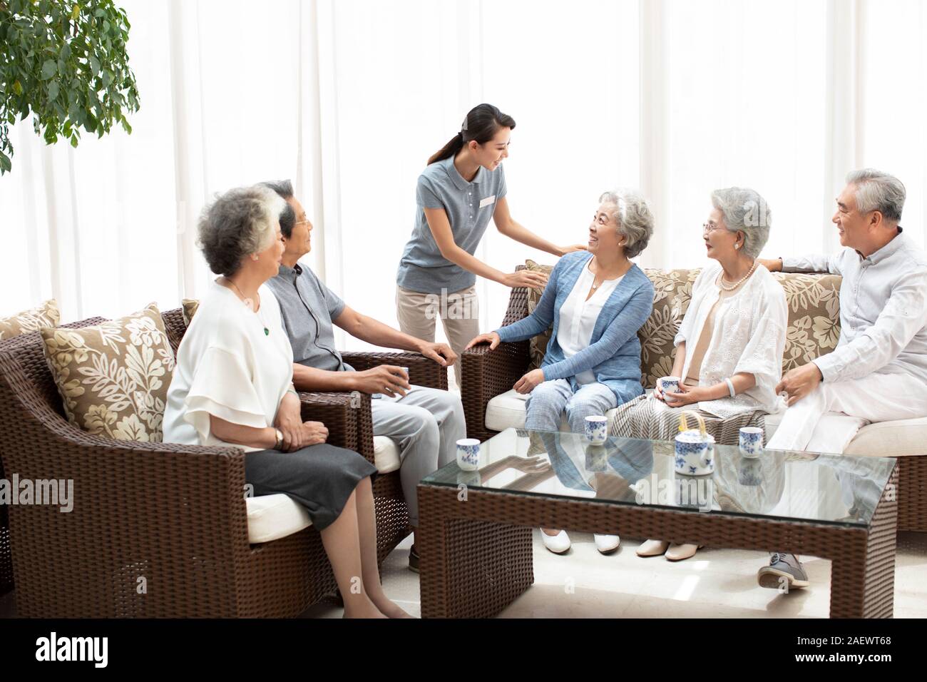 Senior friends talking in nursing home Stock Photo - Alamy