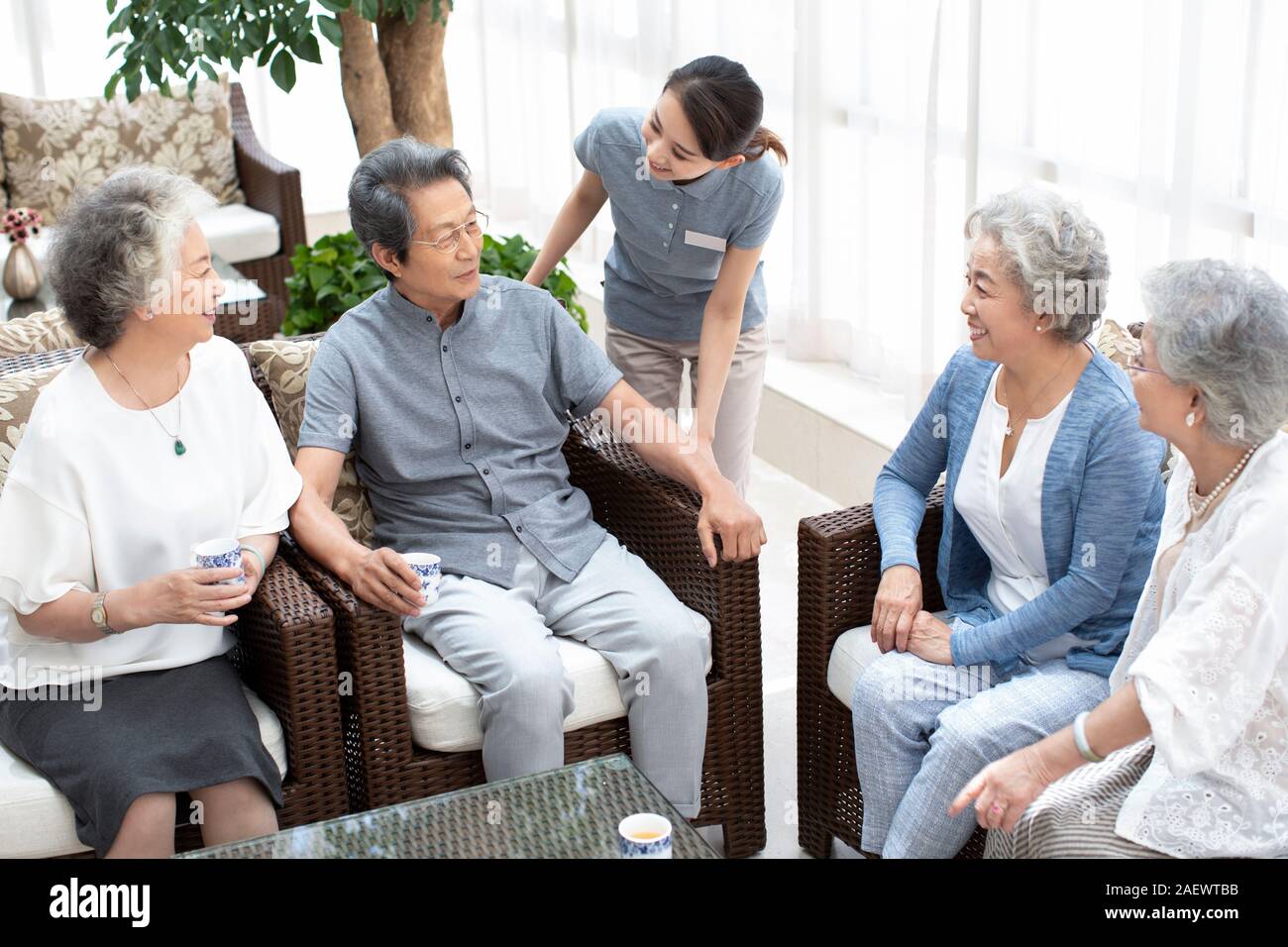 Senior friends talking in nursing home Stock Photo - Alamy