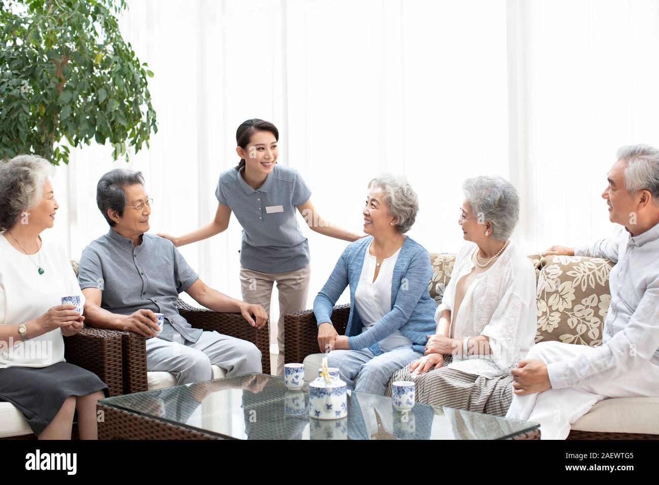 Senior friends talking in nursing home Stock Photo - Alamy