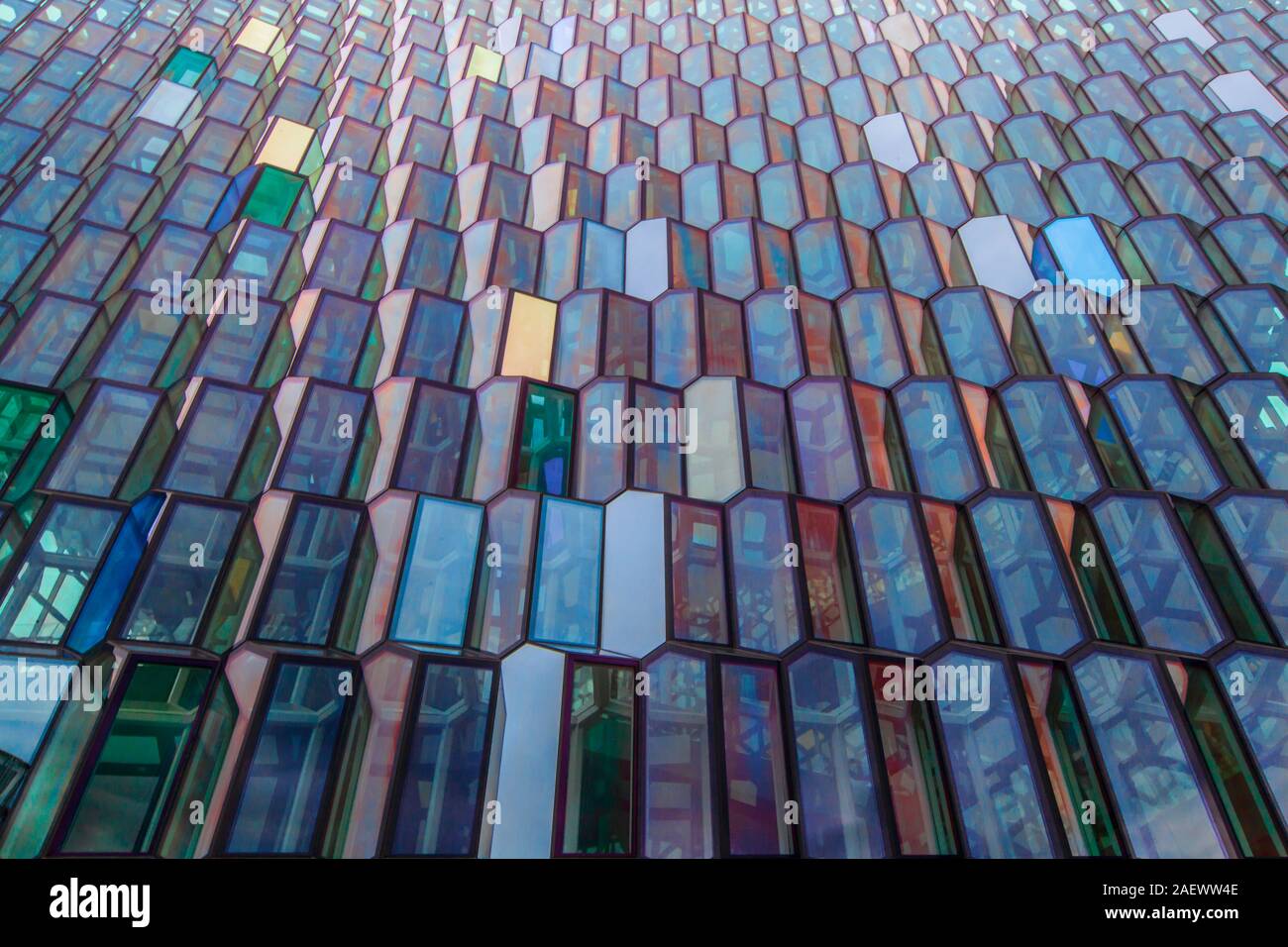 The building features a distinctive colored glass facade inspired by ...