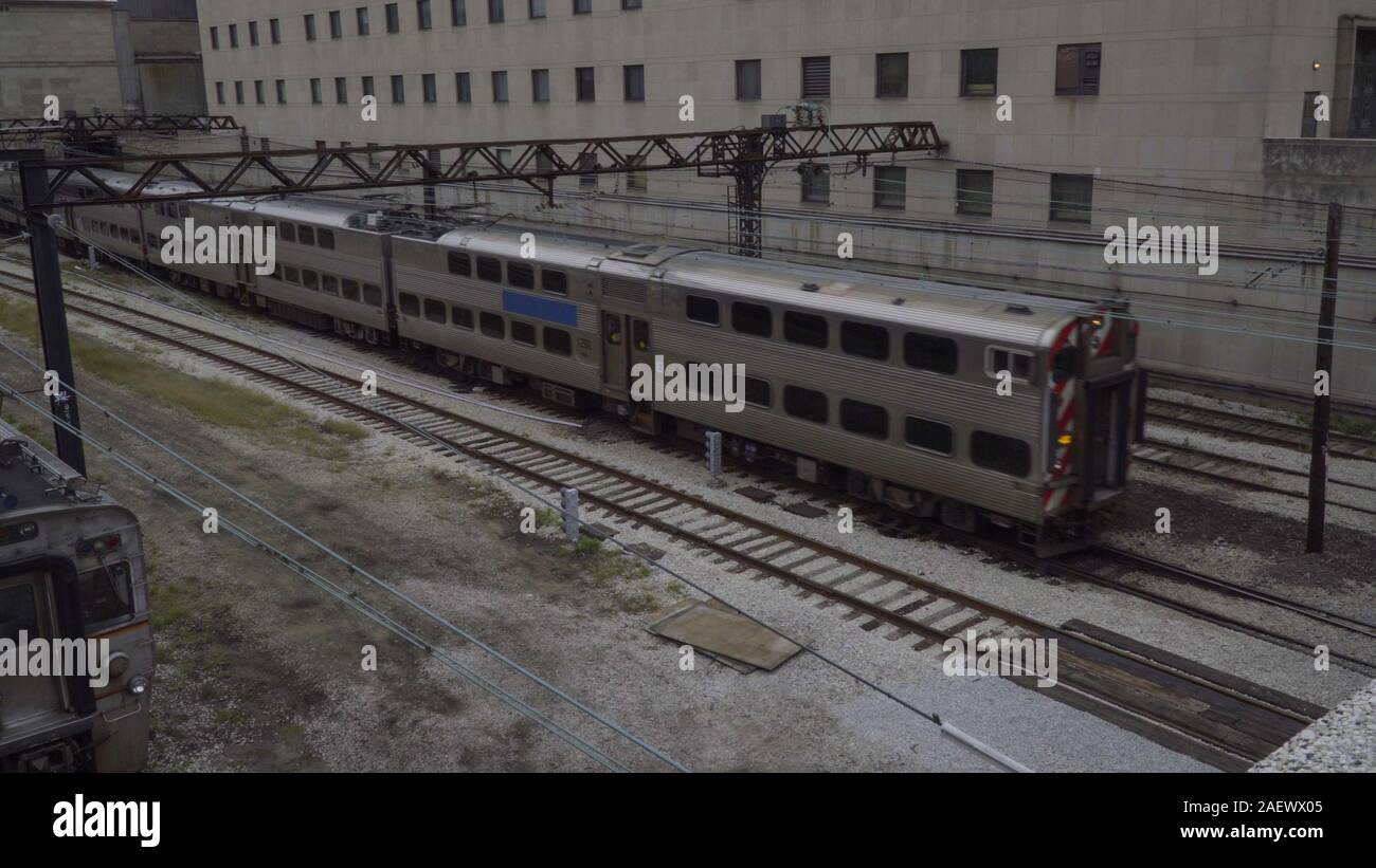 View of long distance transit passenger train passing through railroad ...