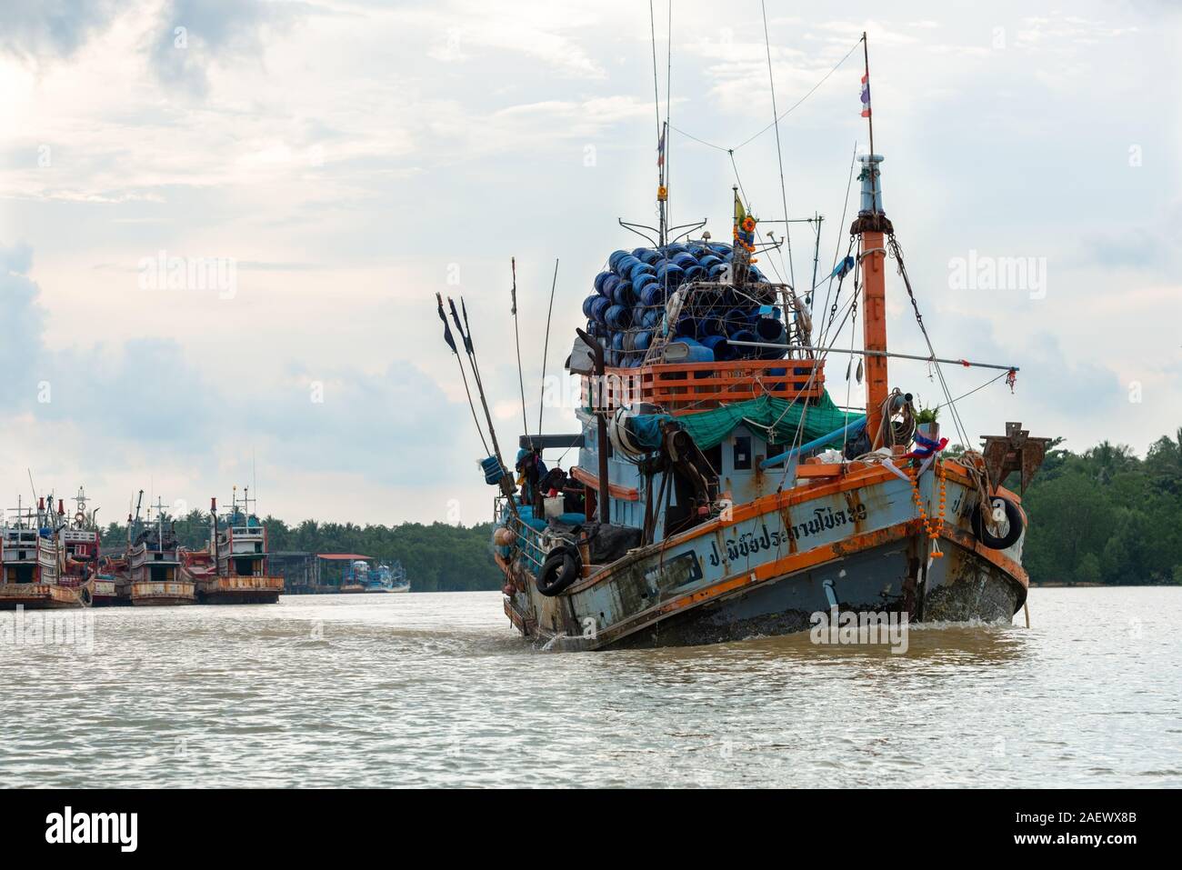 A typical view of thailand river life. Fishing boat on its way Stock ...