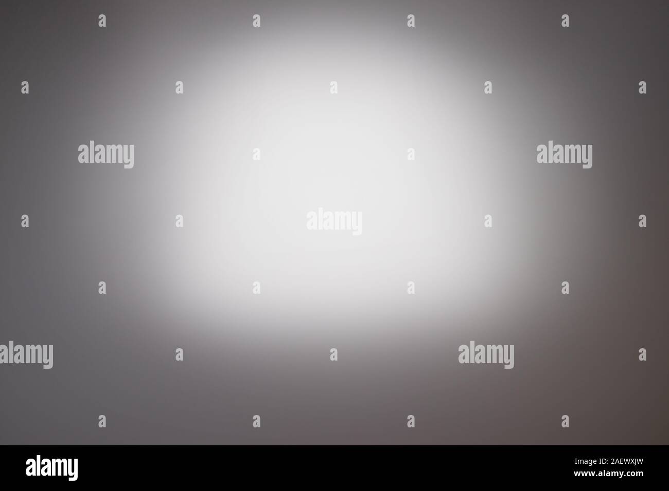 light spot on a gray background Stock Photo - Alamy