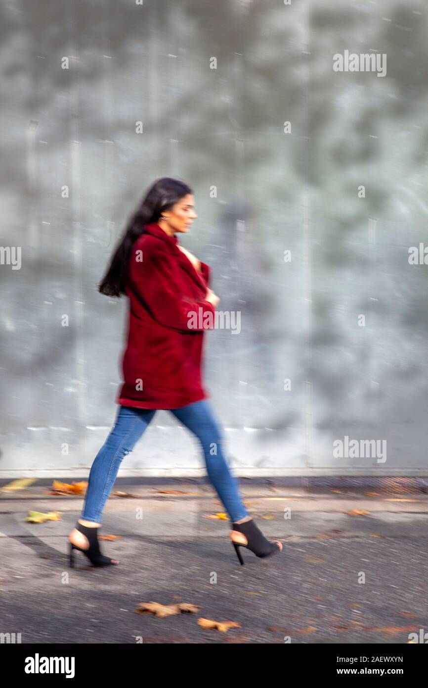 Woman passing in street hi-res stock photography and images - Alamy