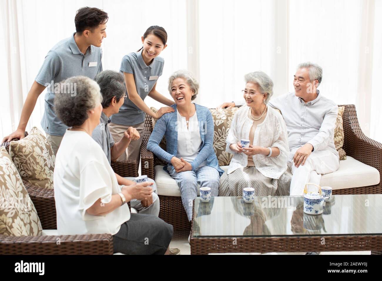 Senior friends talking in nursing home Stock Photo - Alamy