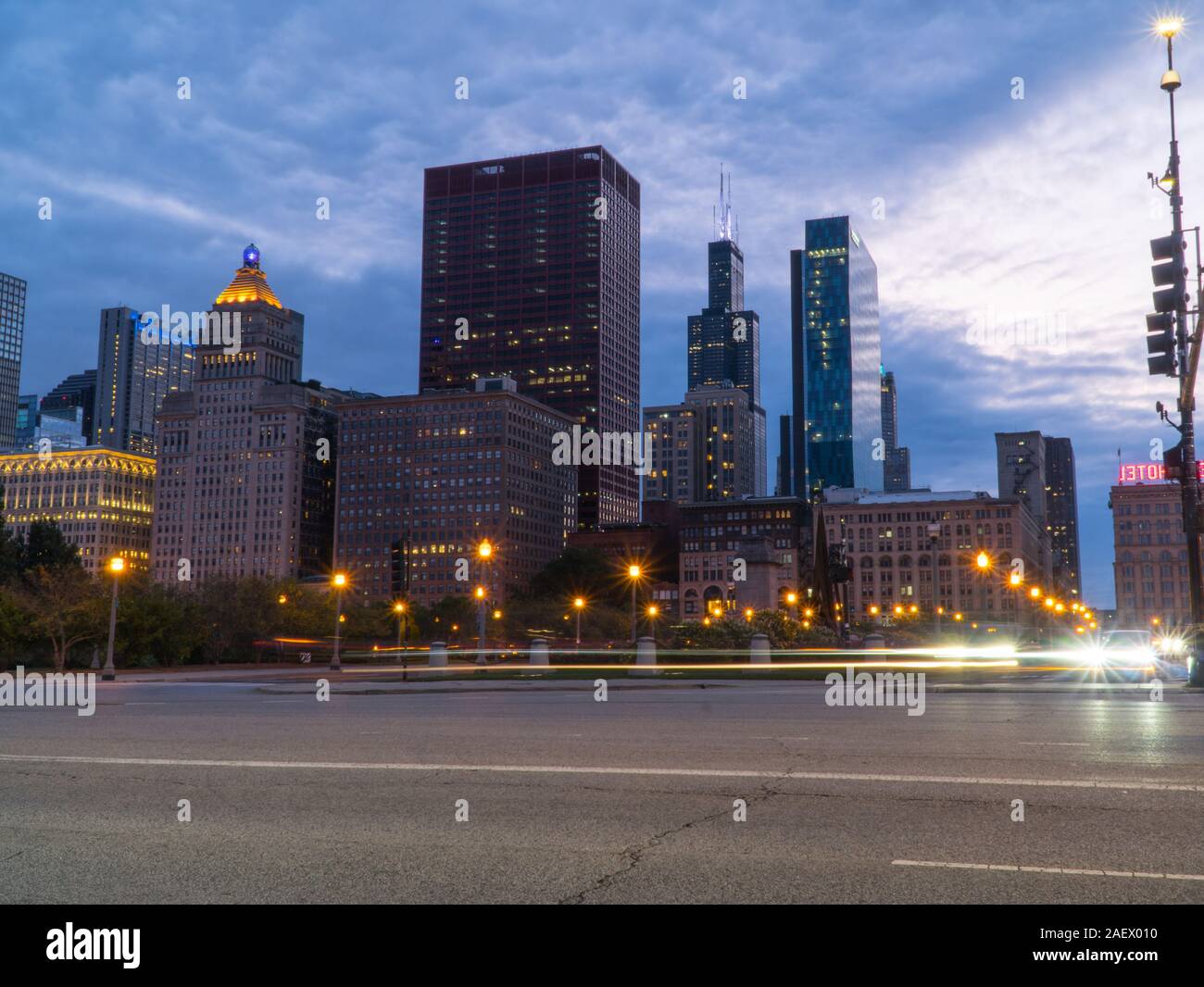 Chicago skyline looking past a busy downtown road at night with car ...