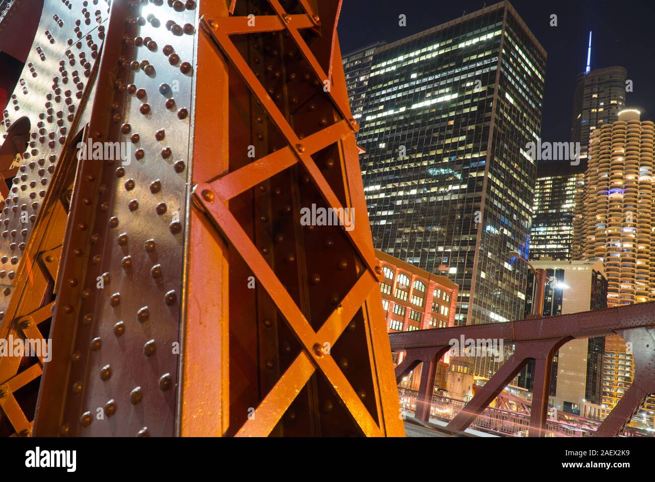 Night time detail shot of bridge overpass steel support columns with ...
