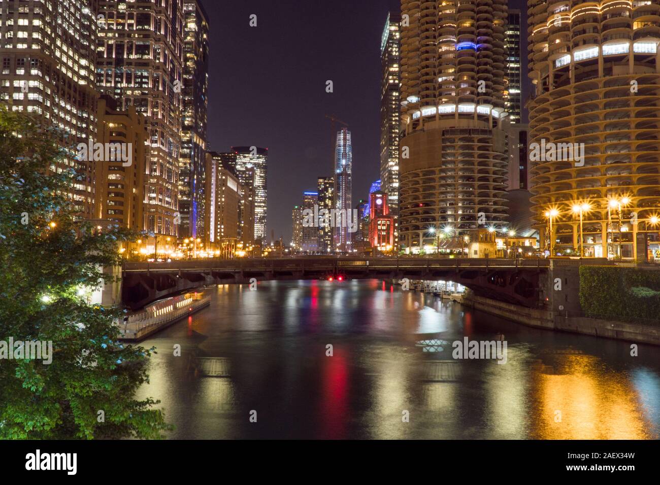 Night time exterior establishing shot overlooking Chicago river front ...