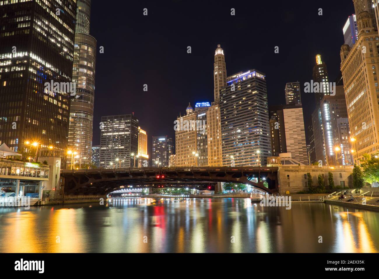 Night time exterior establishing shot overlooking Chicago river front ...