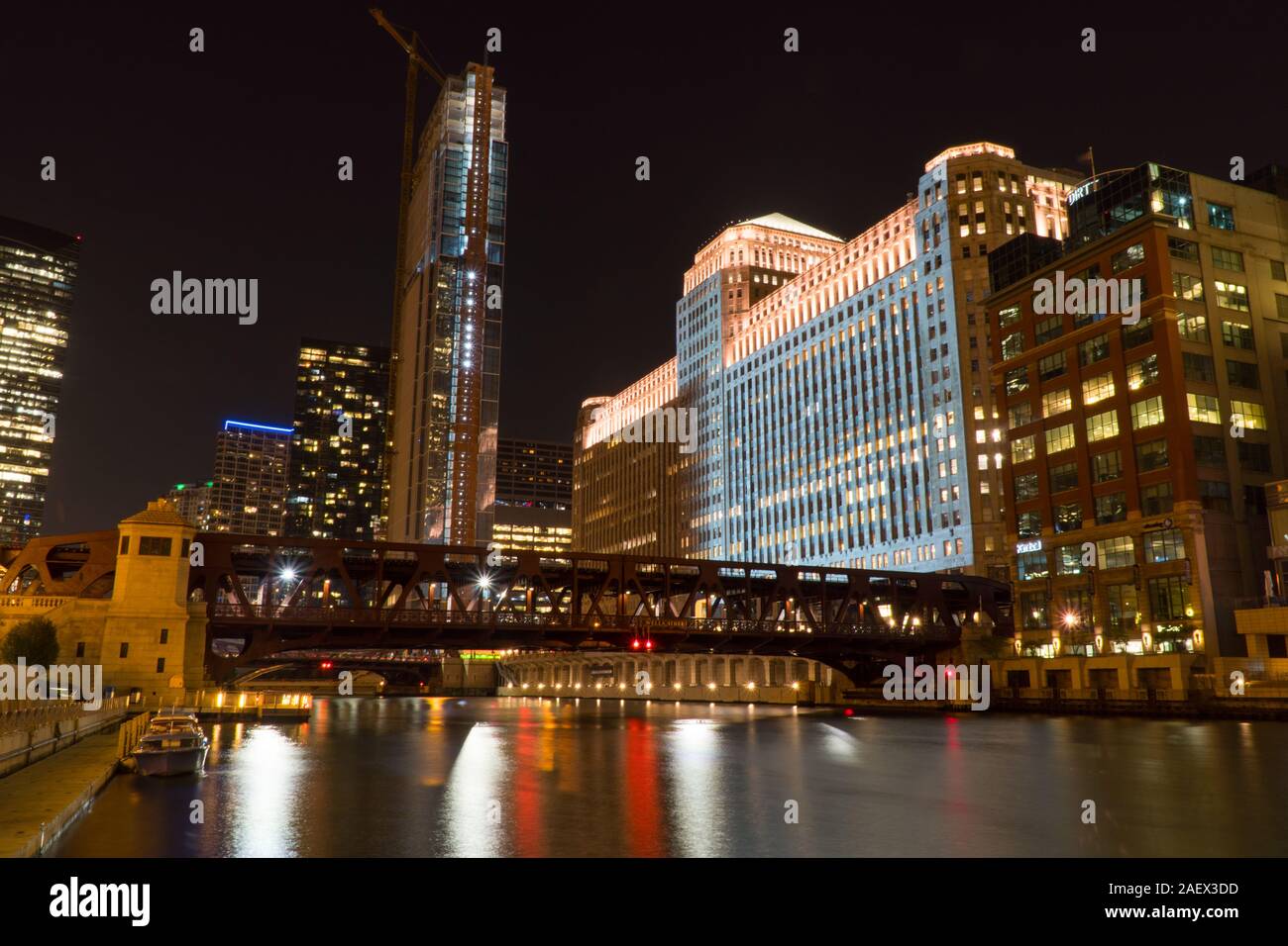Night time exterior establishing shot overlooking Chicago river front ...