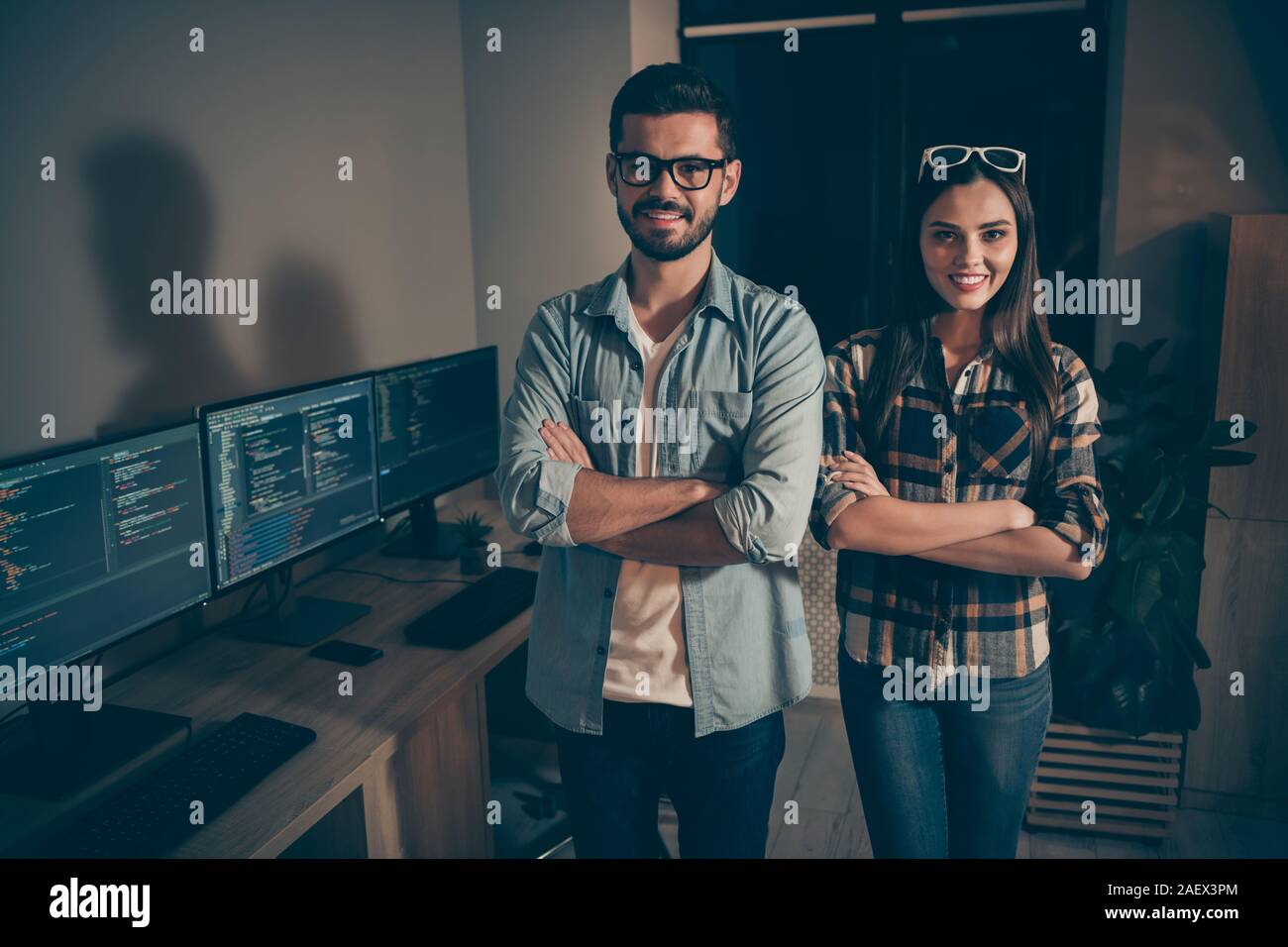 Photo of it specialist guy lady two business people night coworking java script code smart ...