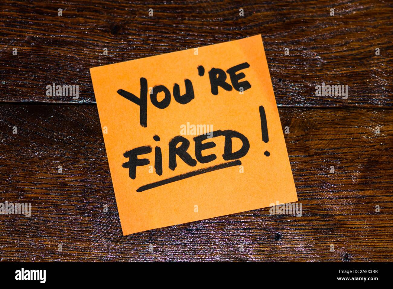 Writing on colorful sticky note you are fired. Text with you are fired ...