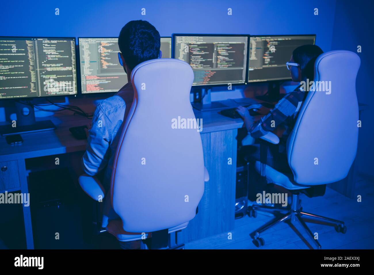 Rear behind view photo of it specialist guy lady business people night ...