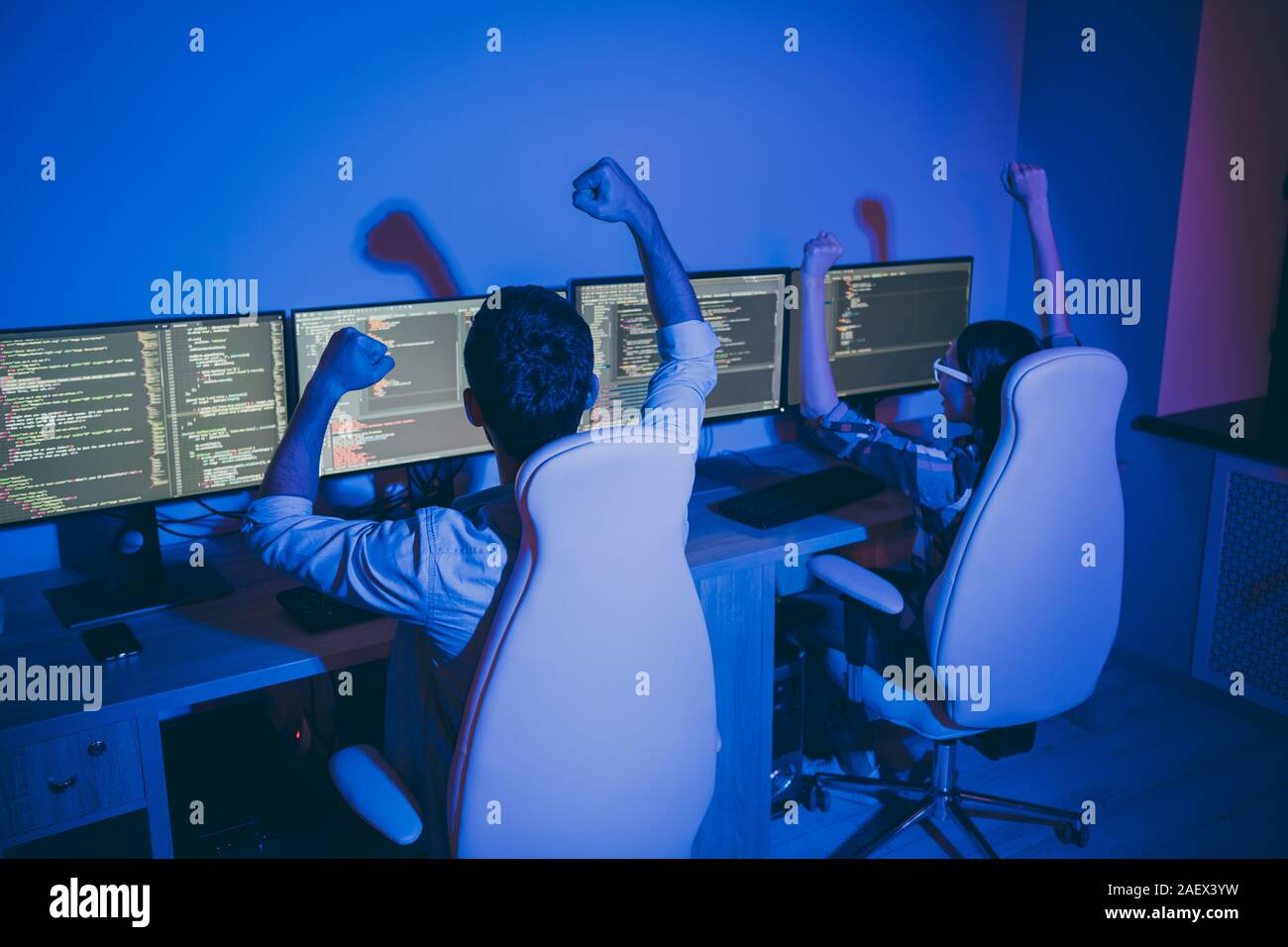 Rear behind view photo of it specialist guy lady business people night ...