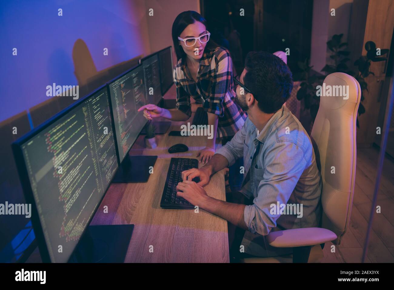 Profile photo of it specialist two business people night coworking ...