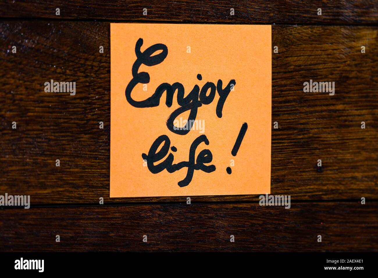 Writing on colorful sticky note Enjoy life. Text with Enjoy life on ...
