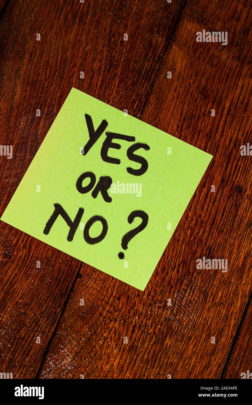 Writing on colorful sticky note Yes or No? Text with question Yes or No ...