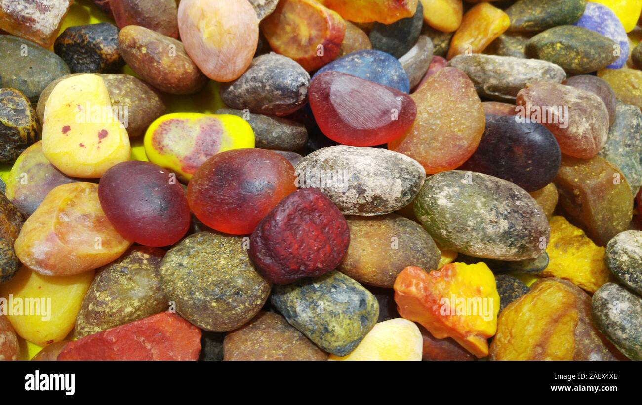 A close-up of the amber wax raw materials that can be honed to create a ...