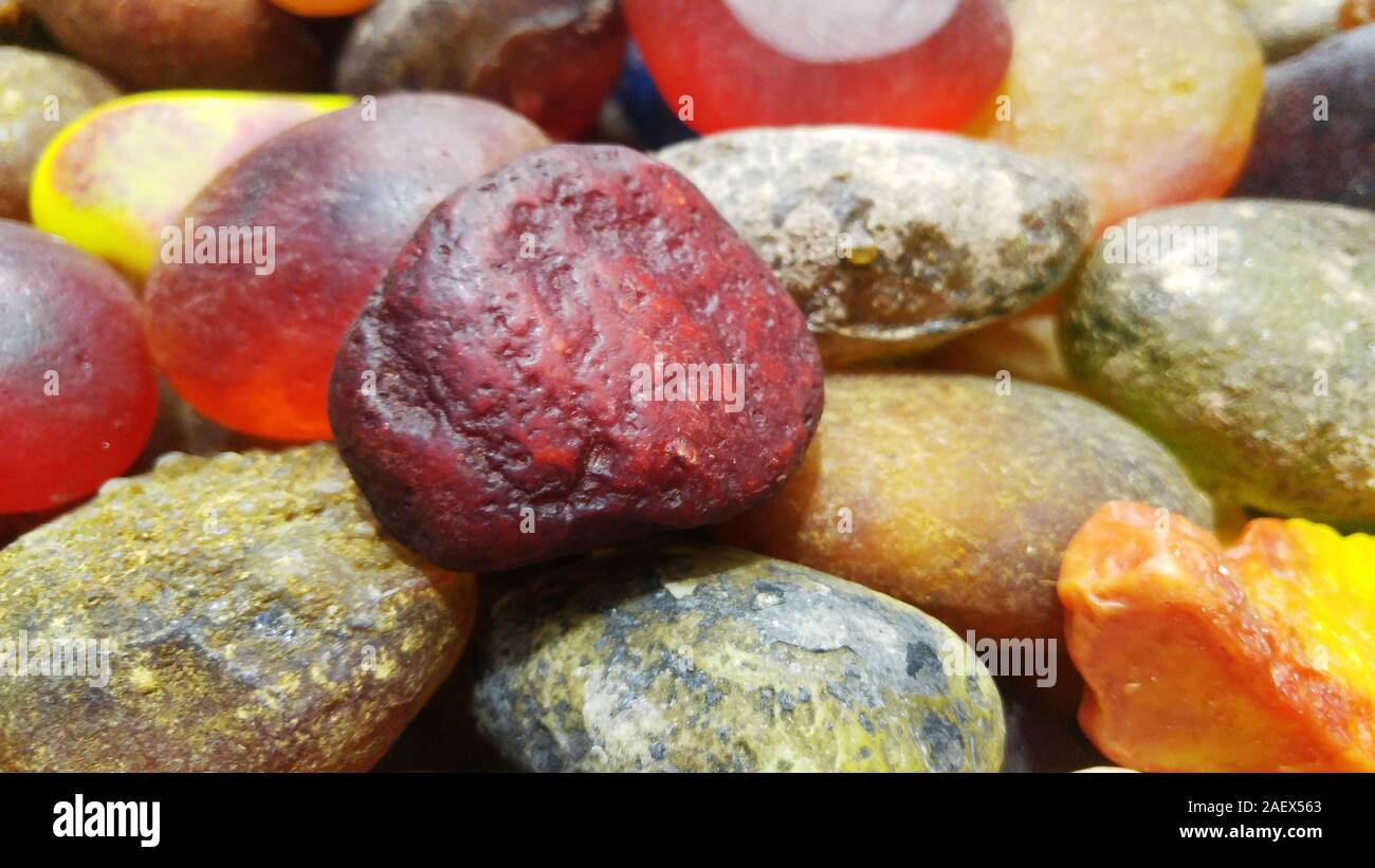 A close-up of the amber wax raw materials that can be honed to create a ...