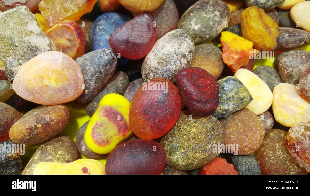A close-up of the amber wax raw materials that can be honed to create a ...