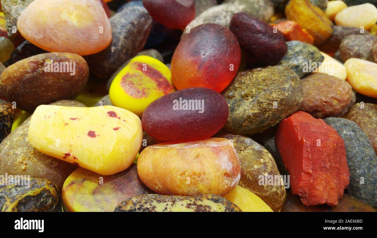 A close-up of the amber wax raw materials that can be honed to create a ...