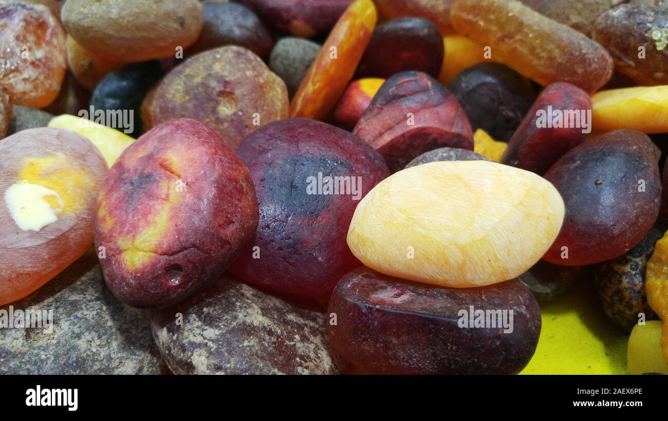 A close-up of the amber wax raw materials that can be honed to create a ...