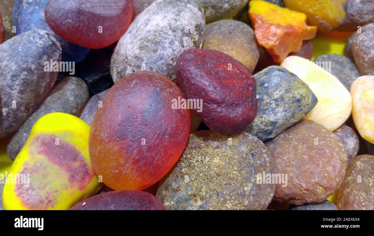 A close-up of the amber wax raw materials that can be honed to create a ...
