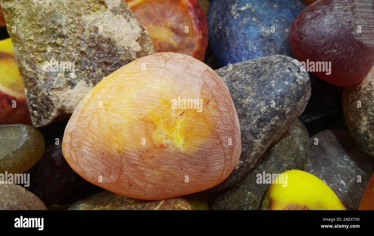 A close-up of the amber wax raw materials that can be honed to create a ...