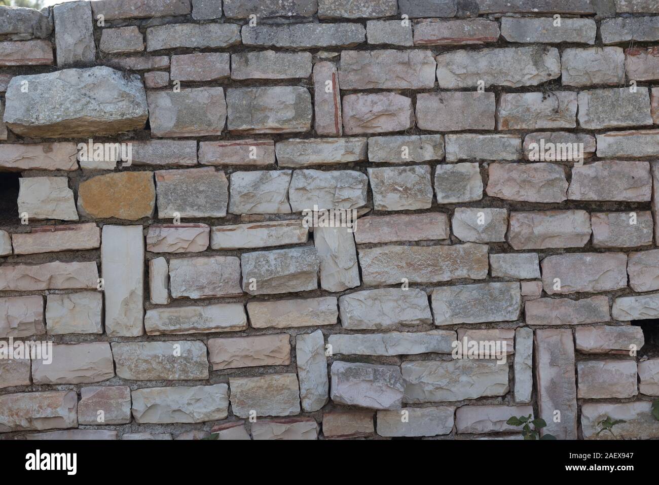 Stunning brick wall of Jerusalem stones in the beautiful garden near ...