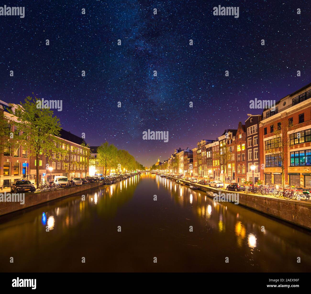 Beautiful calm night view of Amsterdam city. Night time illuminations ...