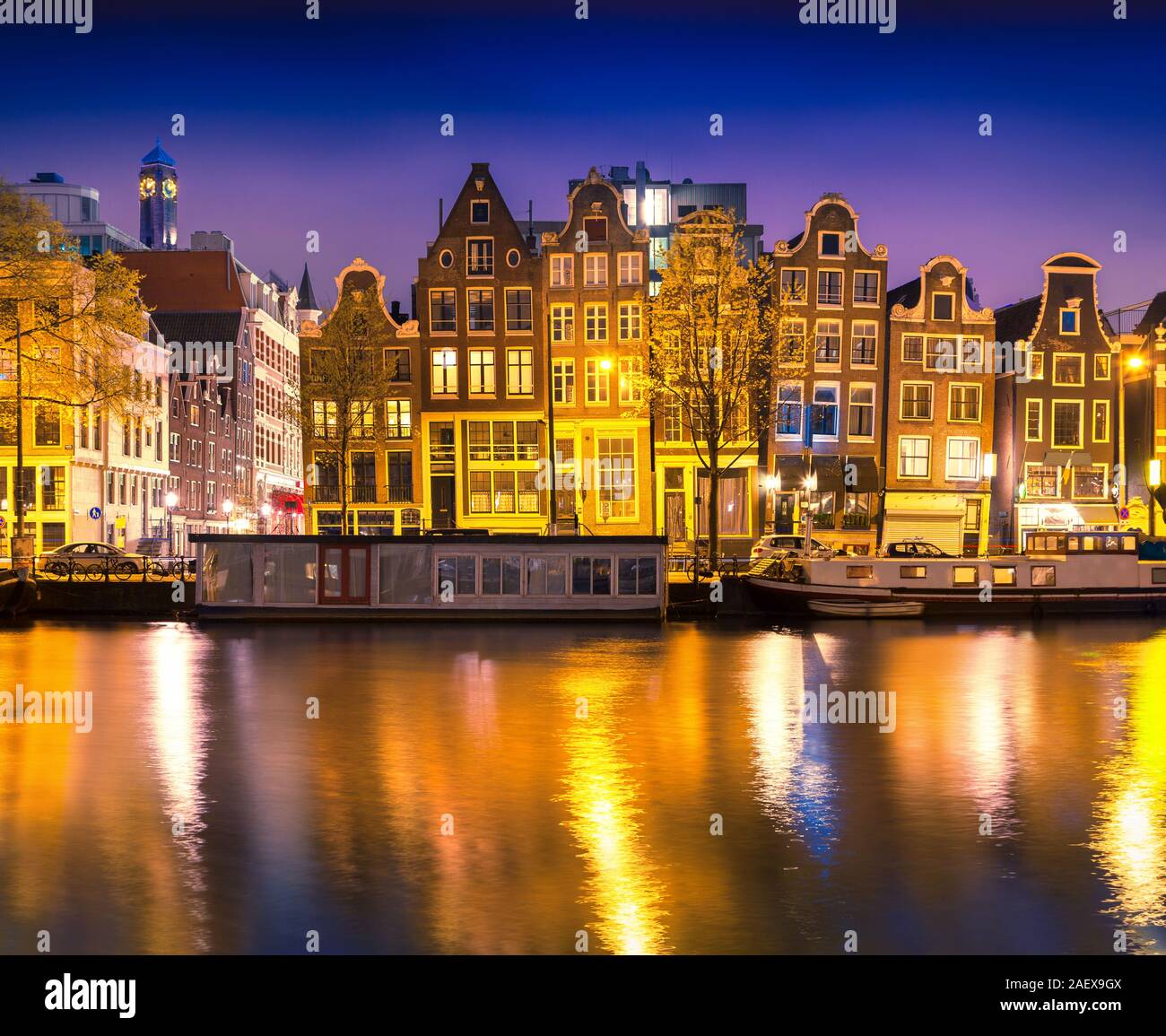 Beautiful calm night view of Amsterdam city. Night time illuminations ...