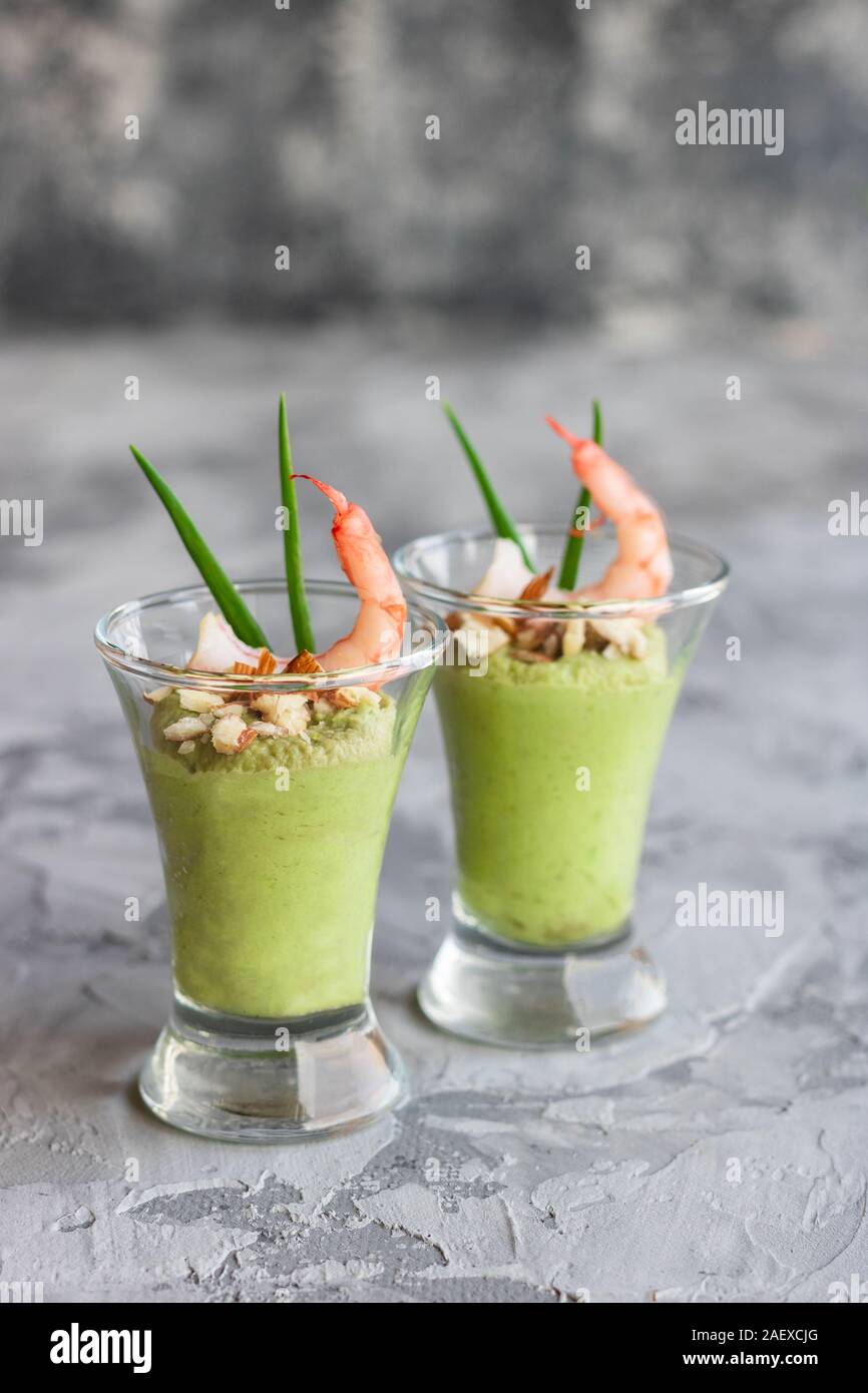 Avocado and green apple mousse with shrimp and almonds. Portion ...