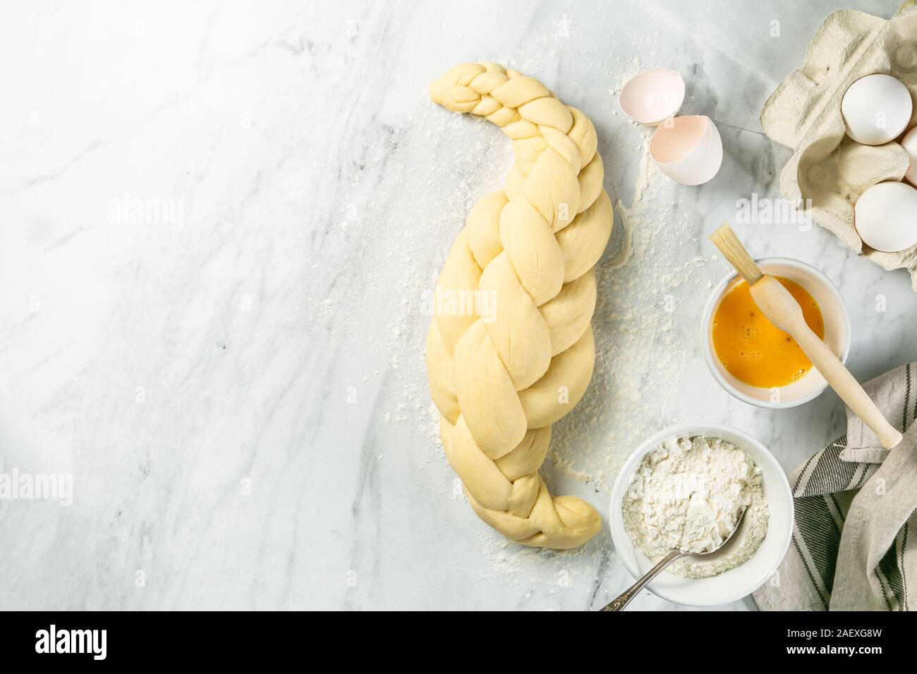 Making traditional jewish challah bread on marble background Stock ...
