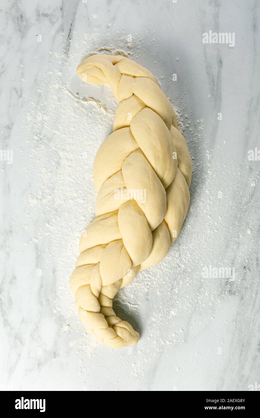 Making traditional jewish challah bread on marble background Stock ...