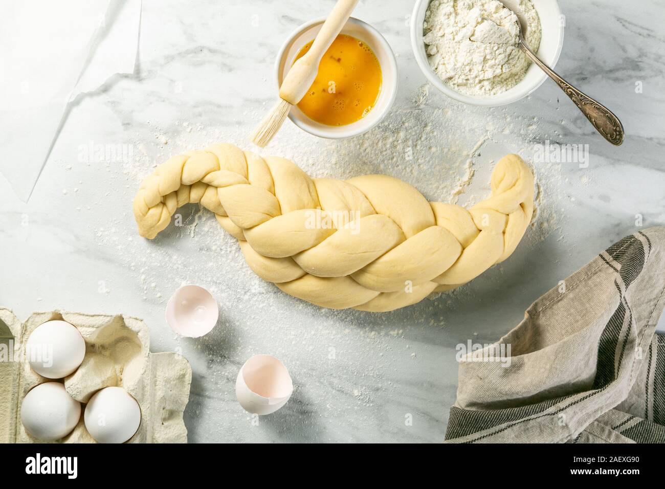 Making traditional jewish challah bread on marble background Stock ...